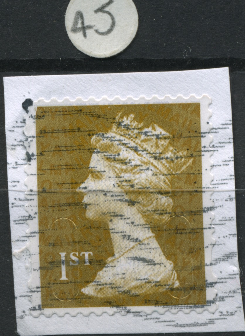 Forged Machin 1st class gold stamp, used on paper