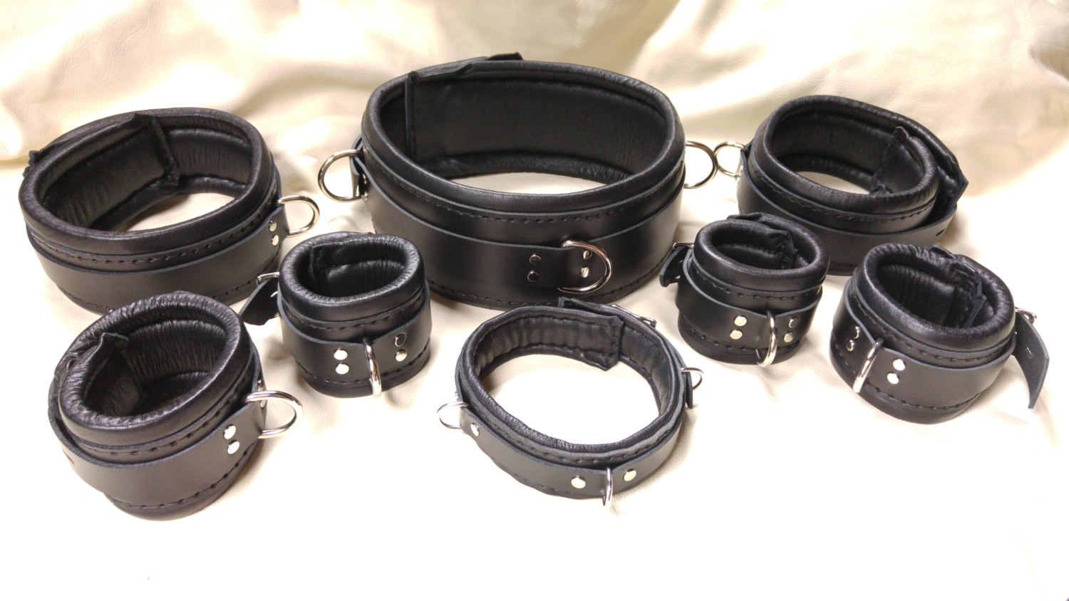 Quality Black bondage cuffs. Lamb leather lined, lifetime quality.