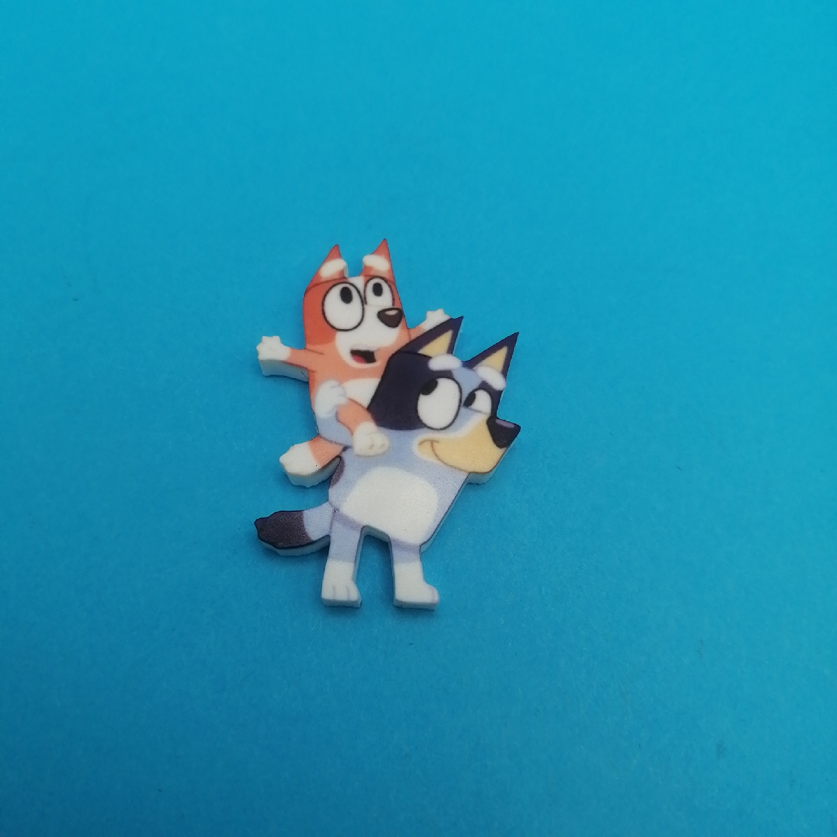 Bluey and Bingo pin badge