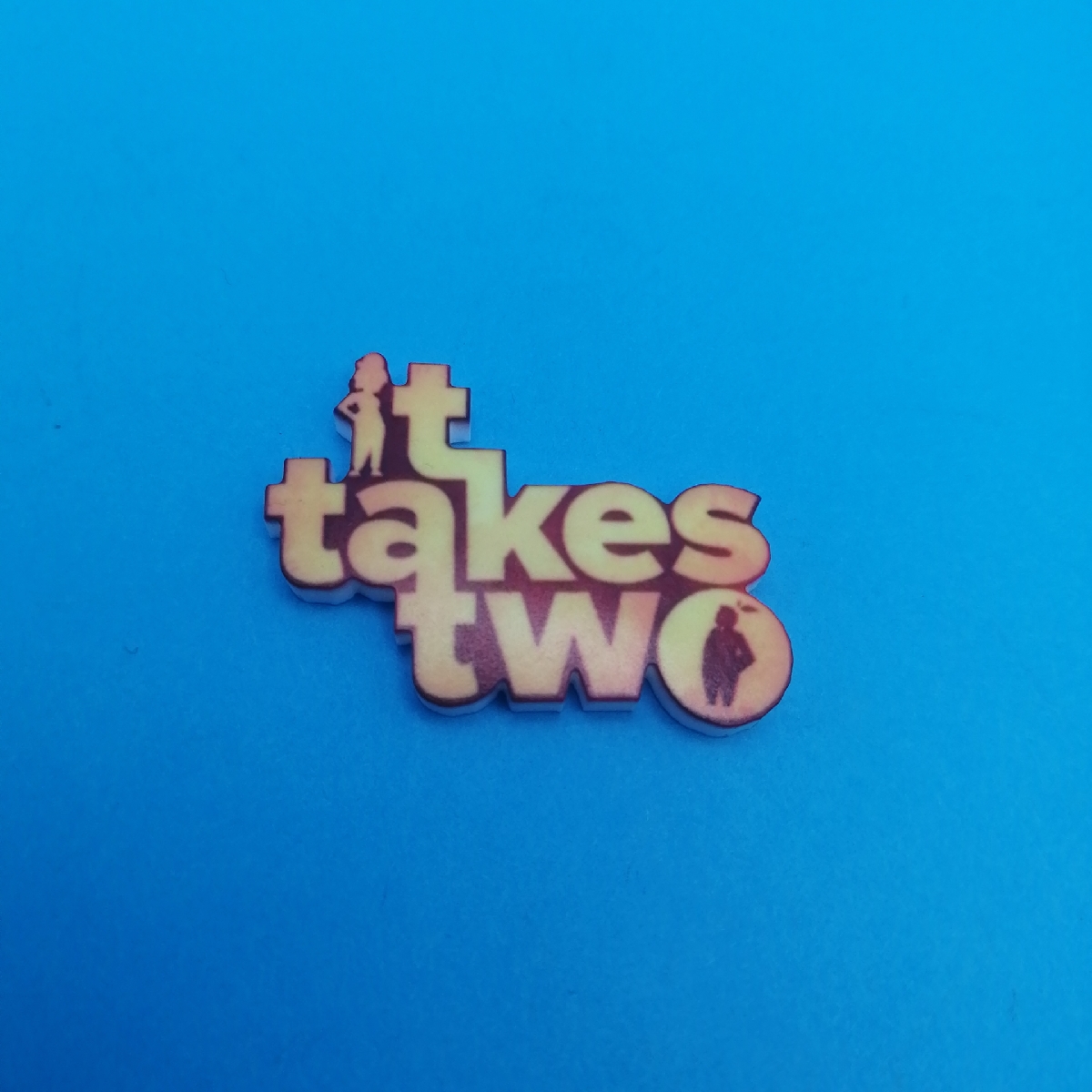 It Takes Two logo pin badge